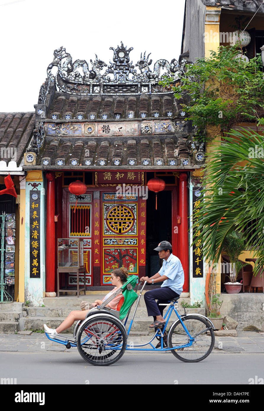 Vietnamese rickshaw driver and passenger. Hoi An, Vietnam. Tourism ...