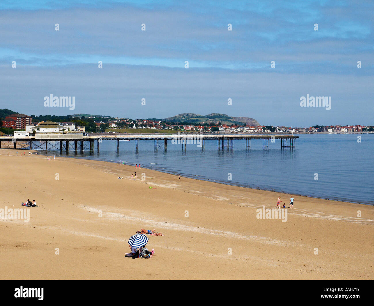 Looking towards Colwyn Bay with sandy beach and derelict pier Wales UK ...