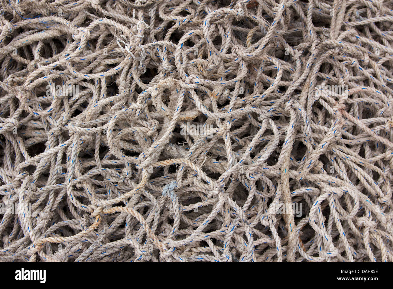 Tangle of ropes forming a textured background Stock Photo - Alamy