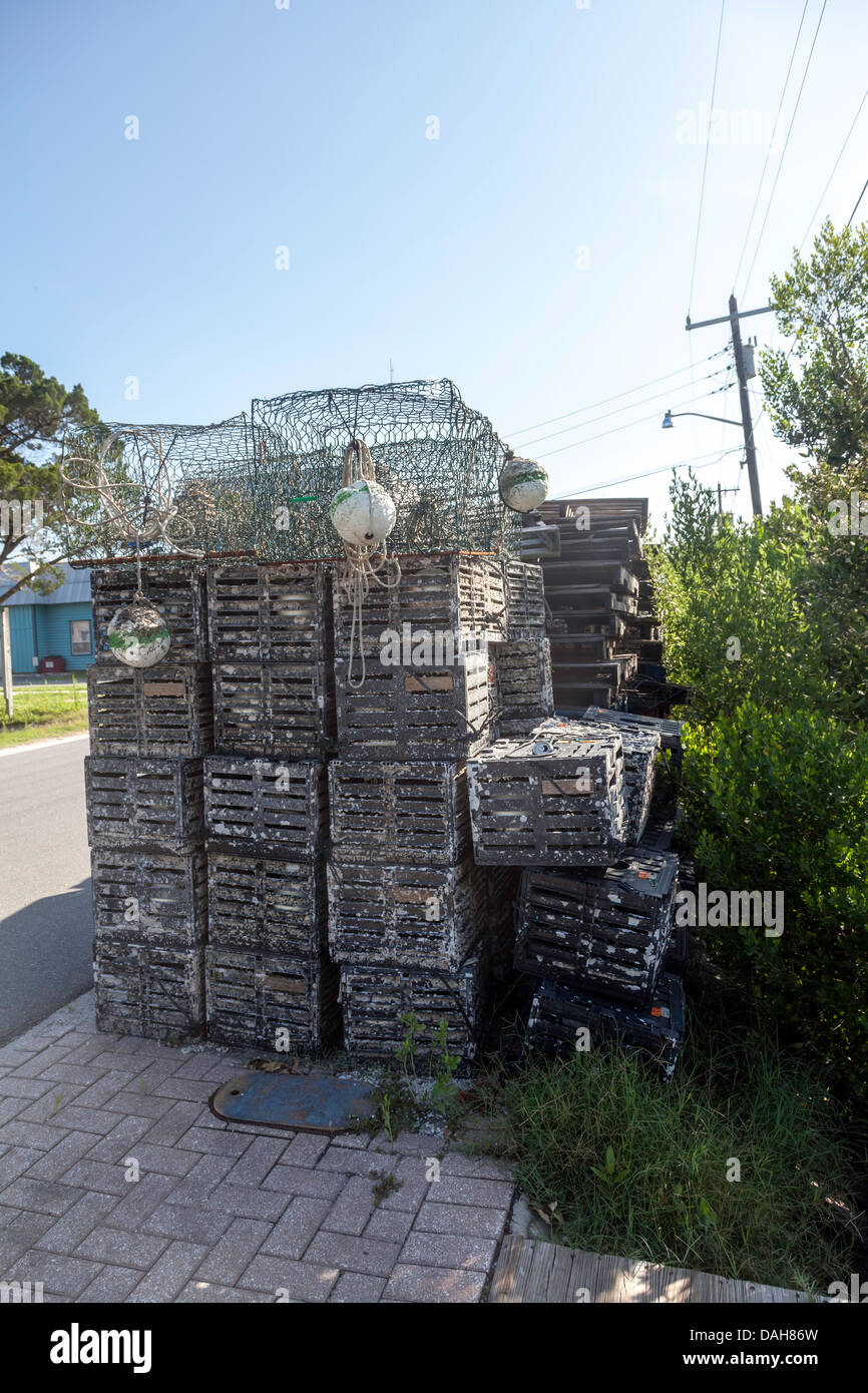 Commercial seafood shellfish traps and floats stacked by the roadside ...
