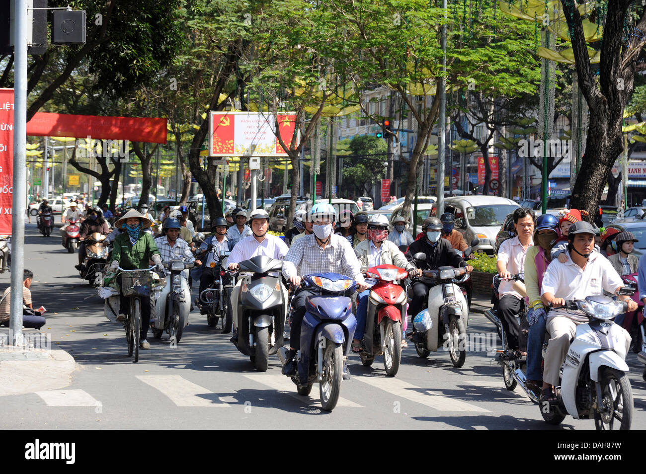 Busy street scene in central Ho Chi Minh City (Saigon). Motorcycle ...