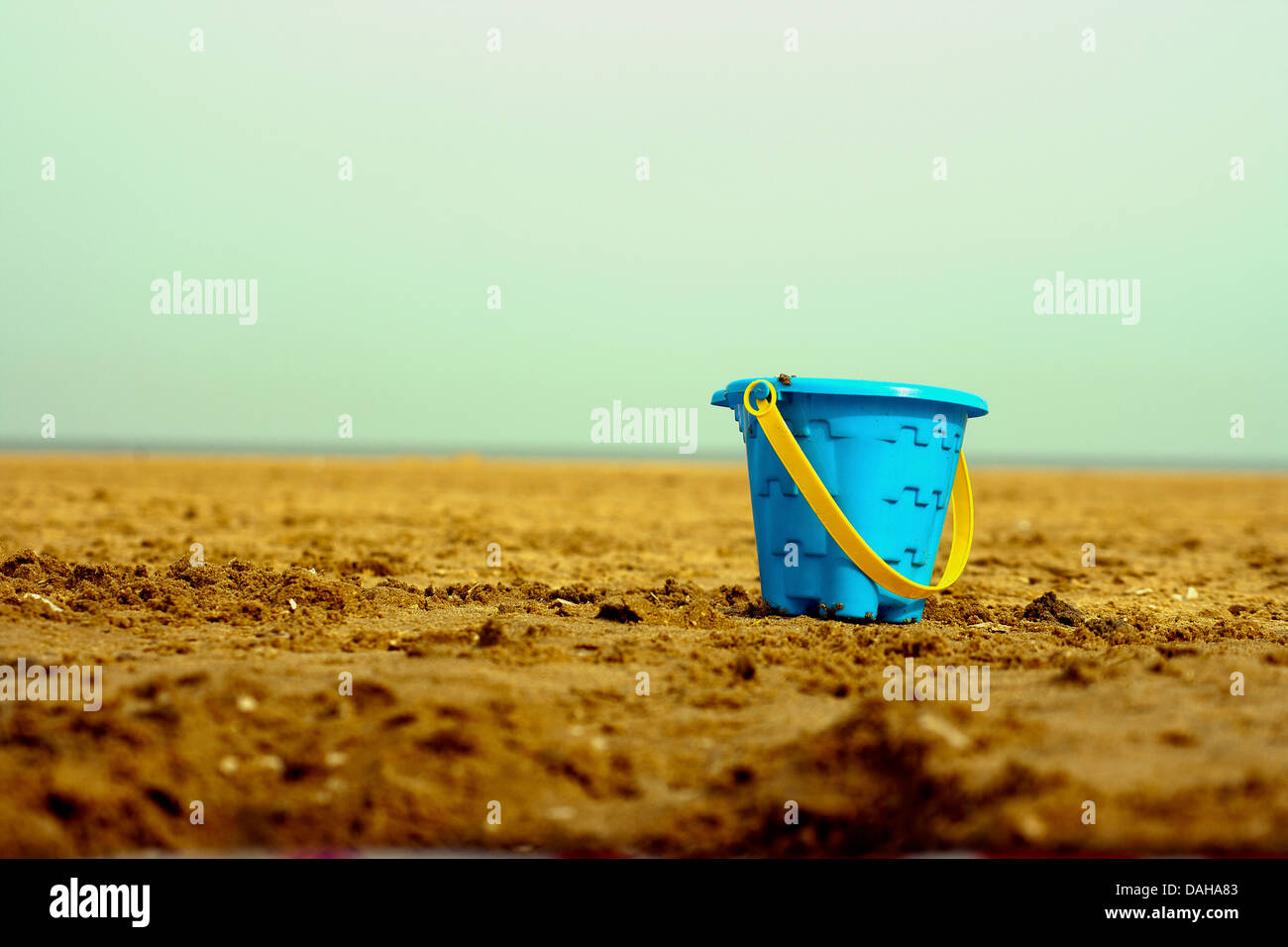 Blue Bucket on the beach Stock Photo - Alamy