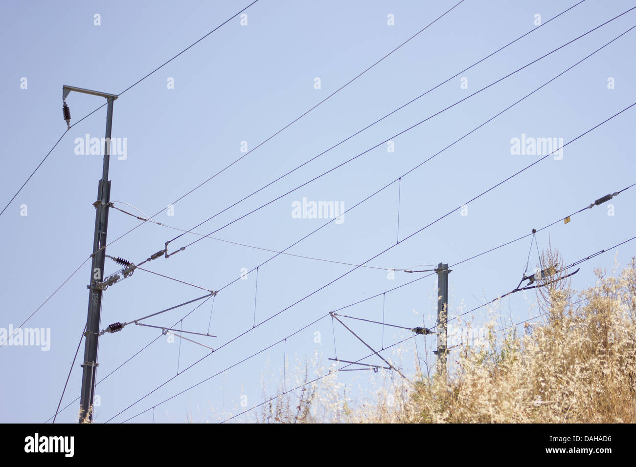 Train railroad electric cables Stock Photo - Alamy