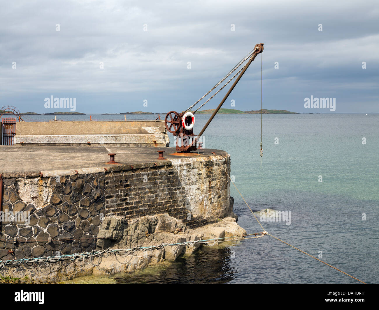 view of an old harbour complete with loading winch Stock Photo - Alamy