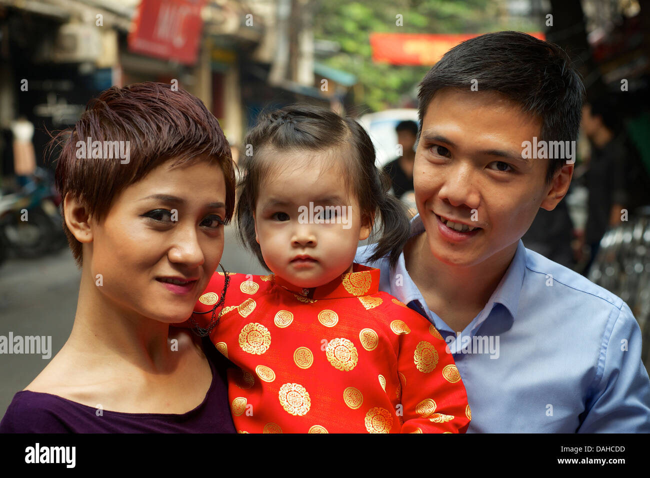 Vietnamese parents with young girl. Hanoi, Vietnam Stock Photo - Alamy