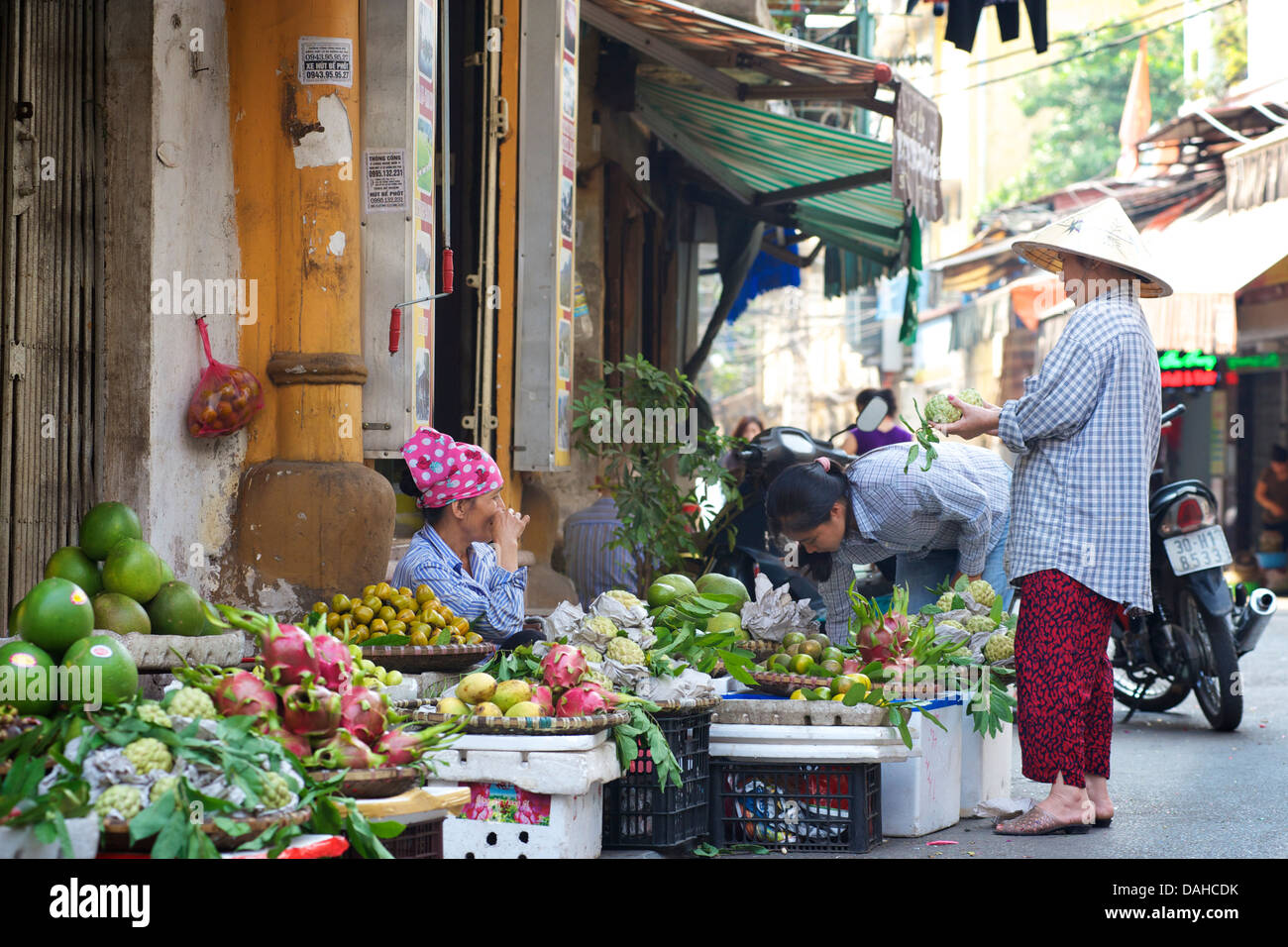 Vietnamese shop selling fruit. Old Quarter, Hanoi, Vietnam Stock Photo ...