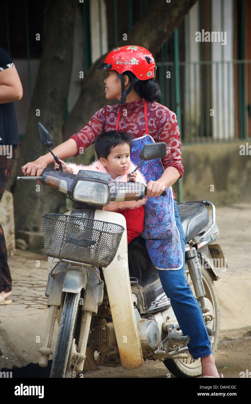 Mother with daughter on motorcycle. Bac Ha, Vietnam Stock Photo - Alamy