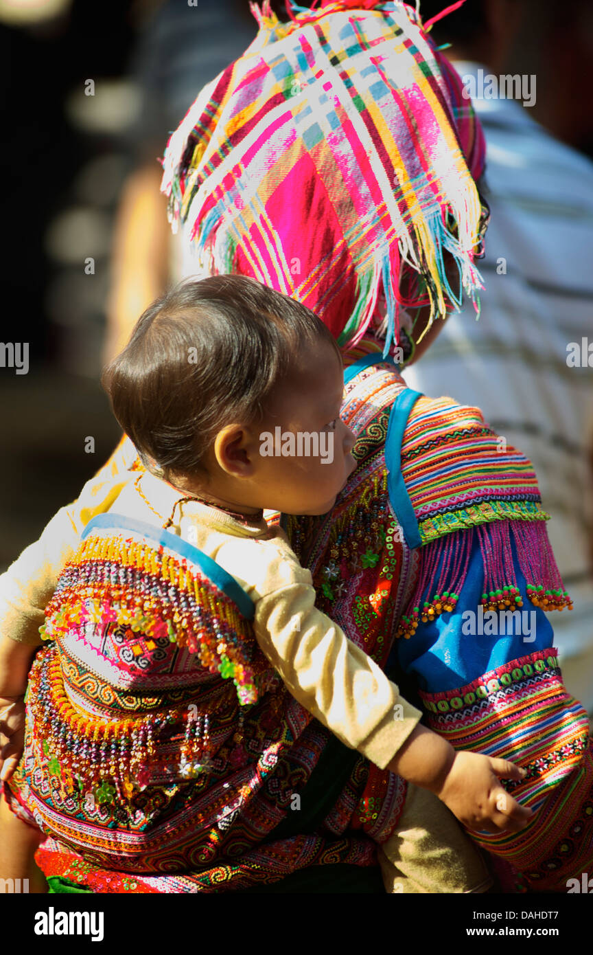Hmong mother carrying child, Bac Ha, Lao Cai Province, Vietnam Stock ...