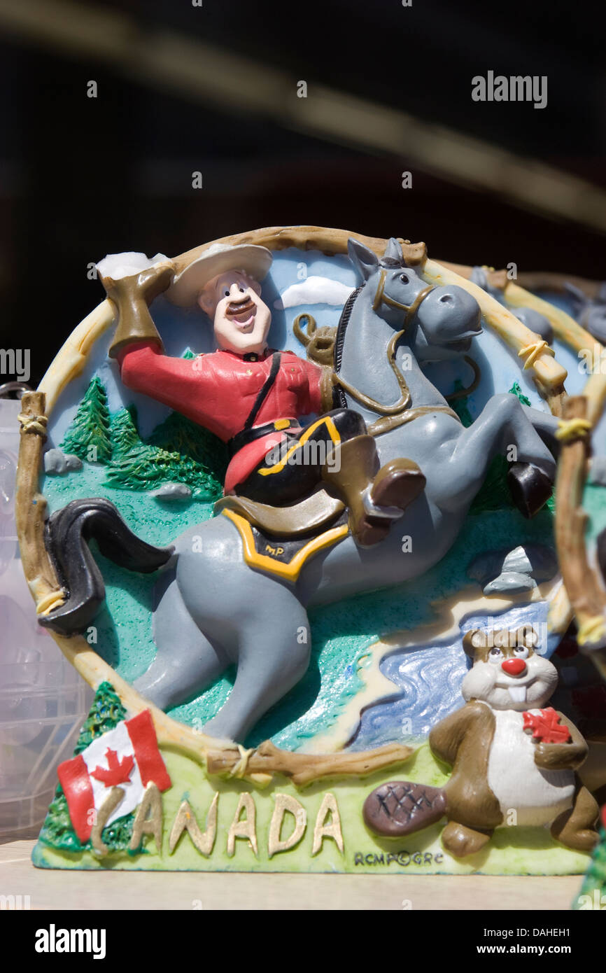 Broken tourist Canada souvenir (chipped hand): cheerful Mountie, beaver ...