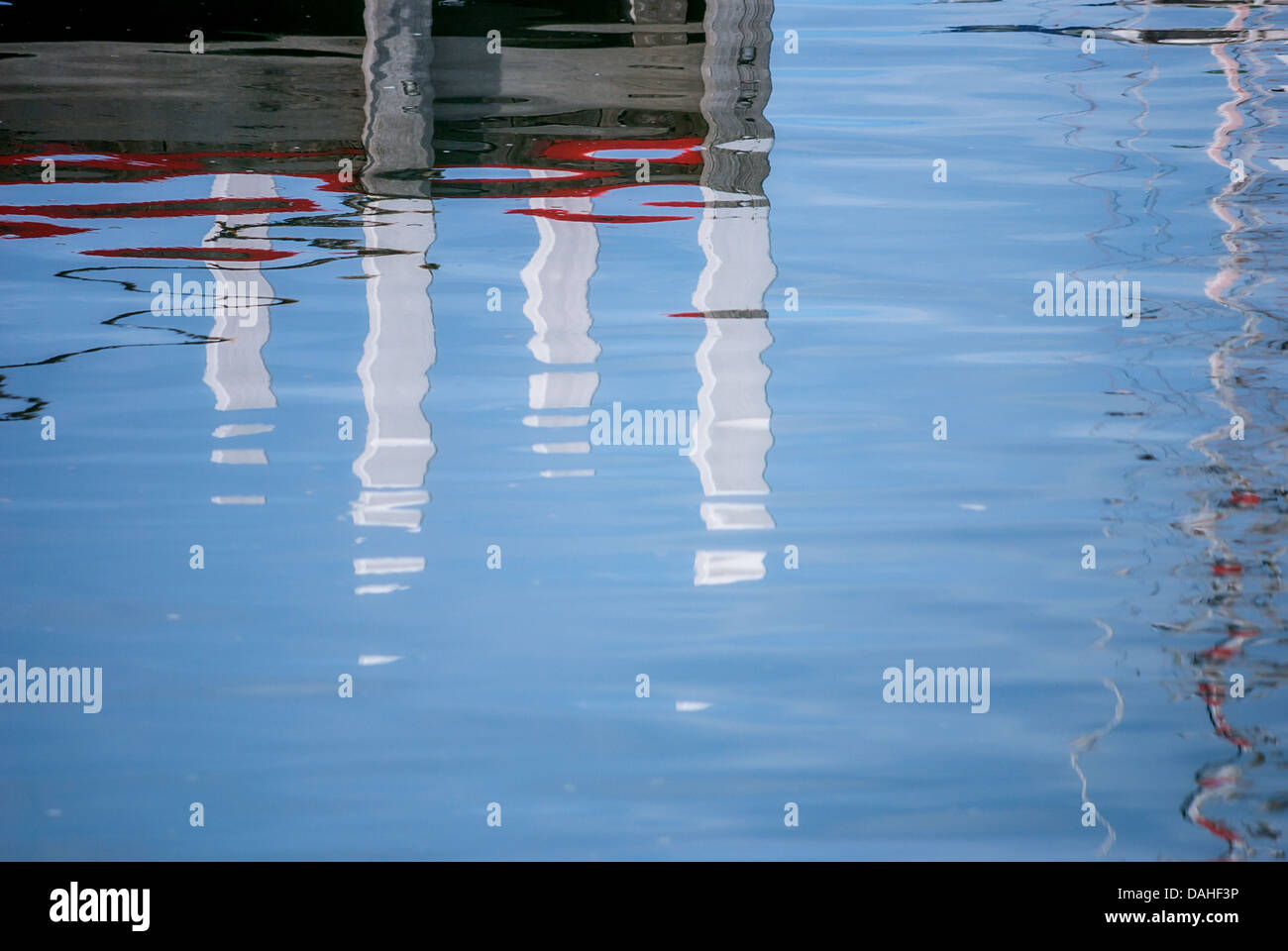 Abstract images of reflections of a boat marina in the rippling water ...