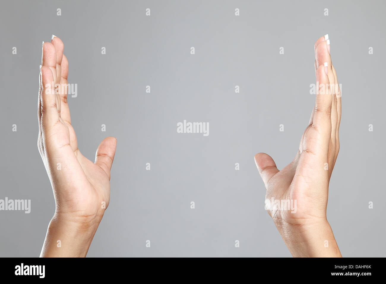 Woman's hands surrounding the space Stock Photo - Alamy