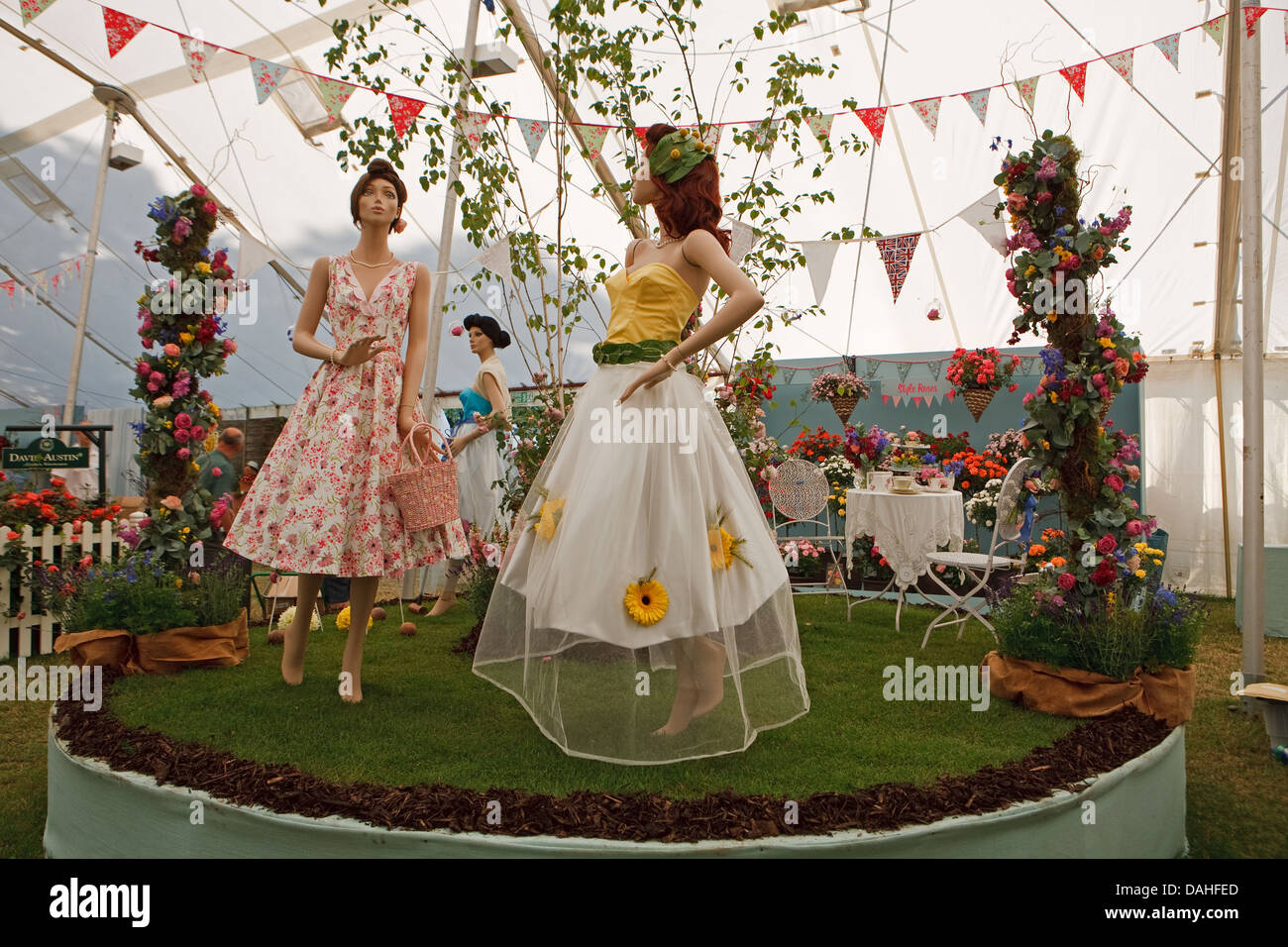 Ladies in floral dresses on display at the RHS Hampton Court Palace ...
