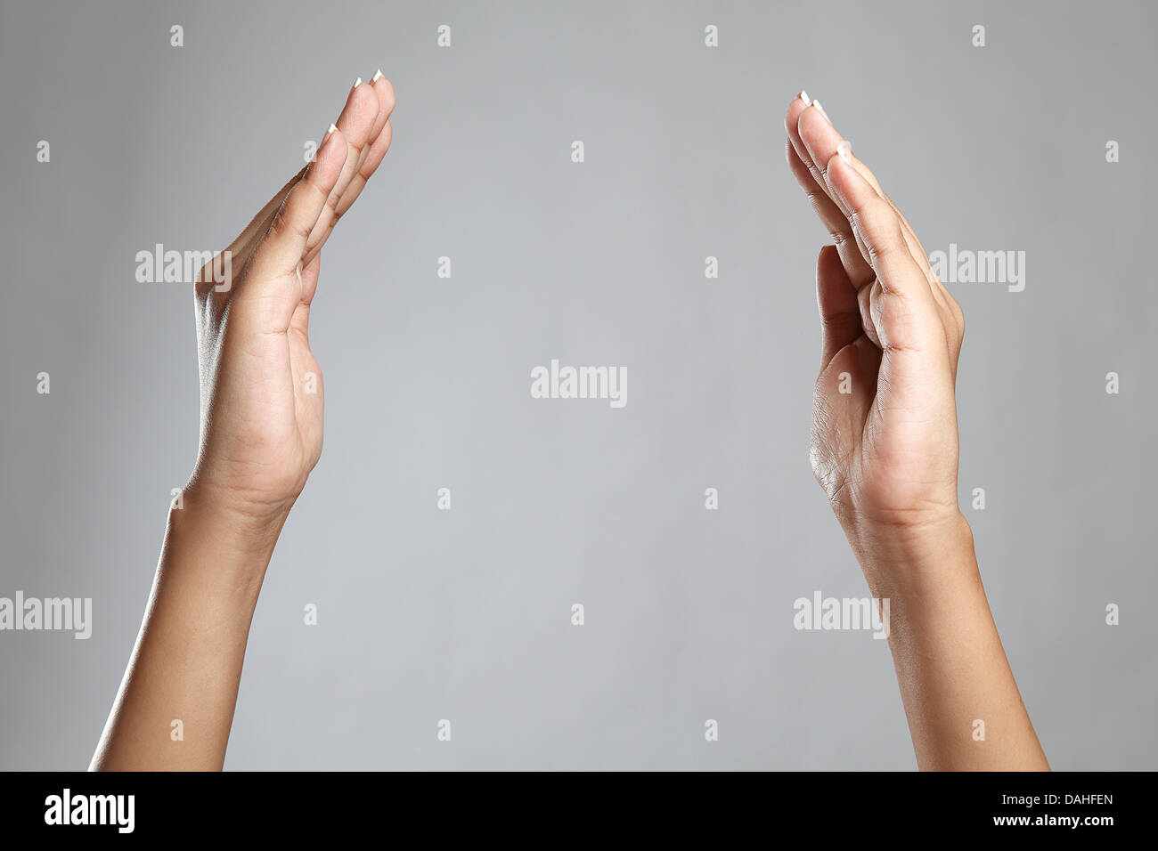 Woman's hands surrounding the space Stock Photo - Alamy