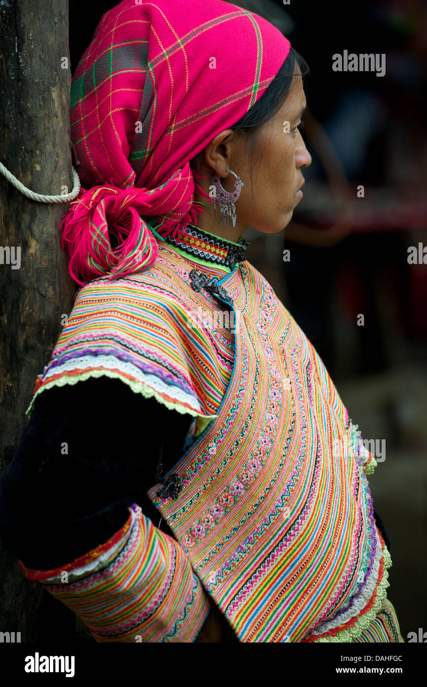 Profile of a Flower Hmong woman in distinctive tribal costume at Bac Ha ...