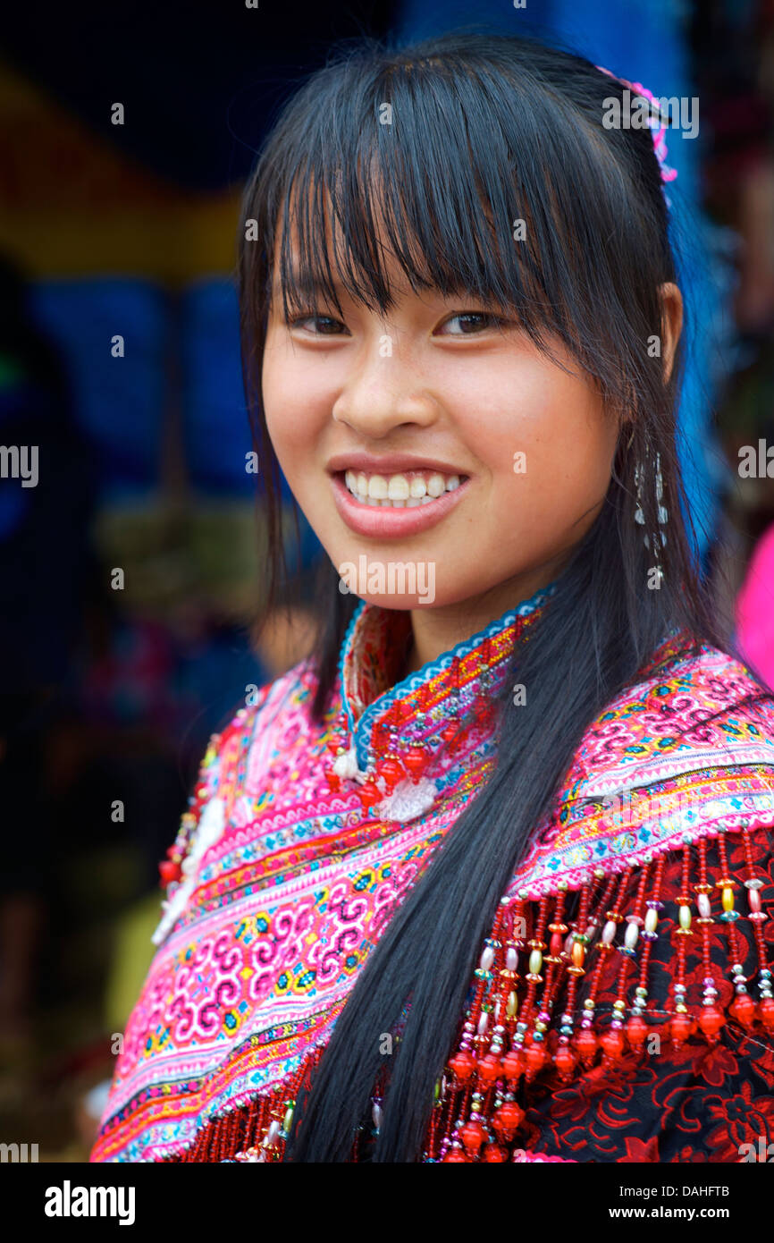 Portrait of a Flower Hmong woman in distinctive tribal costume, Bac Ha ...