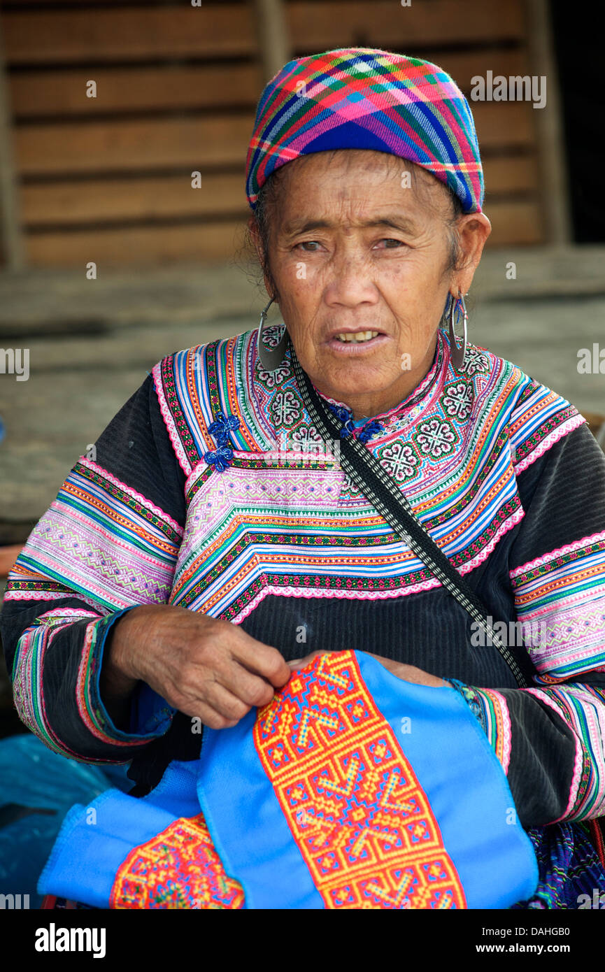 Potrait of a Flower Hmong woman in her brightly embroidered tribal ...