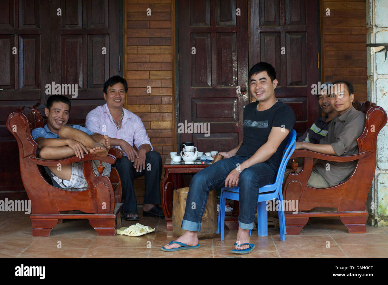 Vietnamese men sitting together and enjoying a cup of tea. Bac Ha. Lao ...