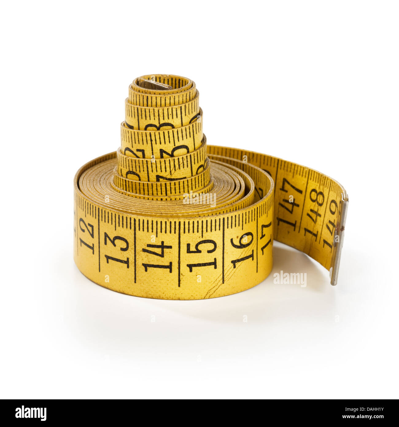 Close-up of yellow old tape measure on white background Stock Photo - Alamy