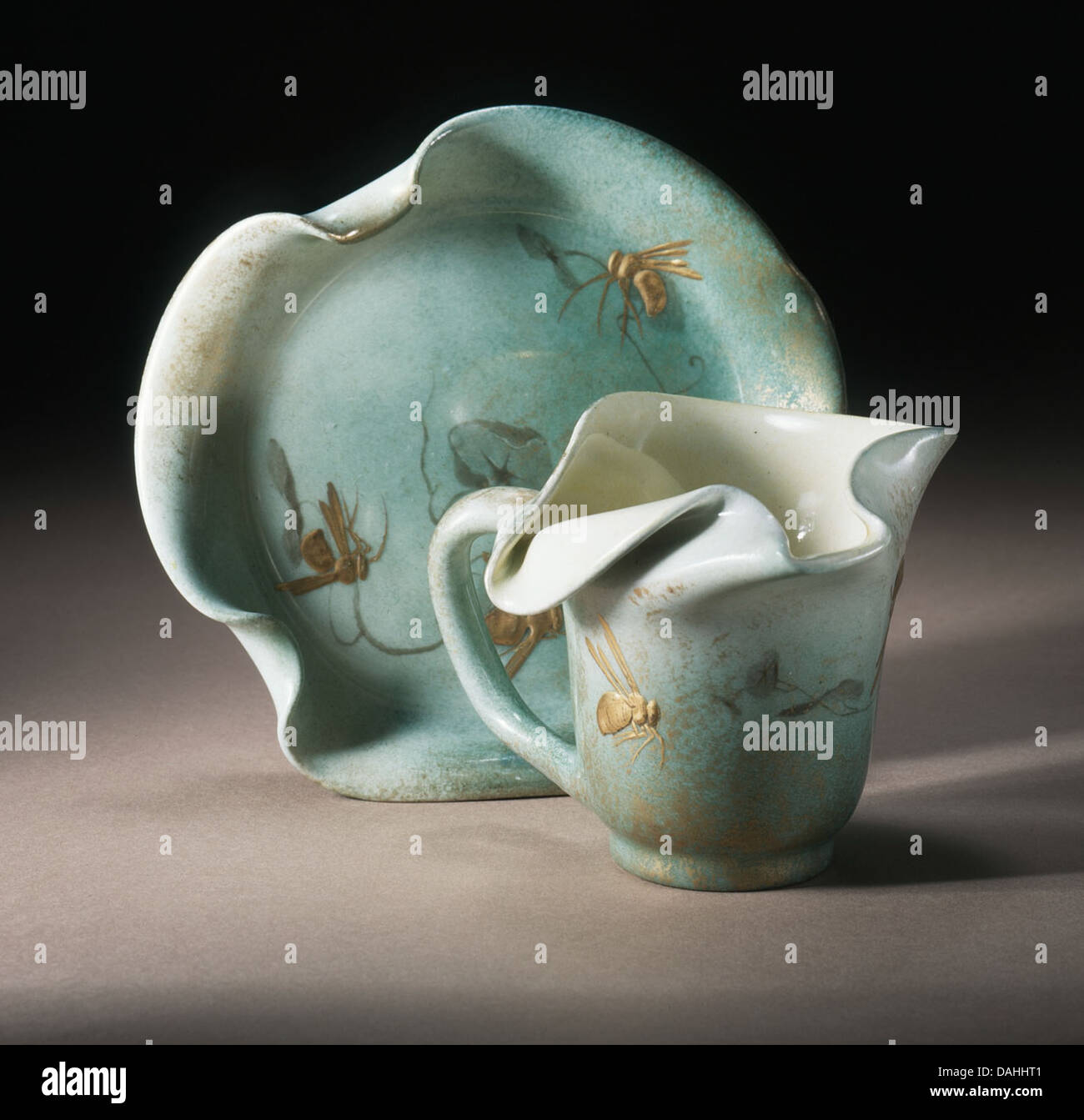 This teacup and saucer set, titled 'Distorted Form with Bees,' is a ...