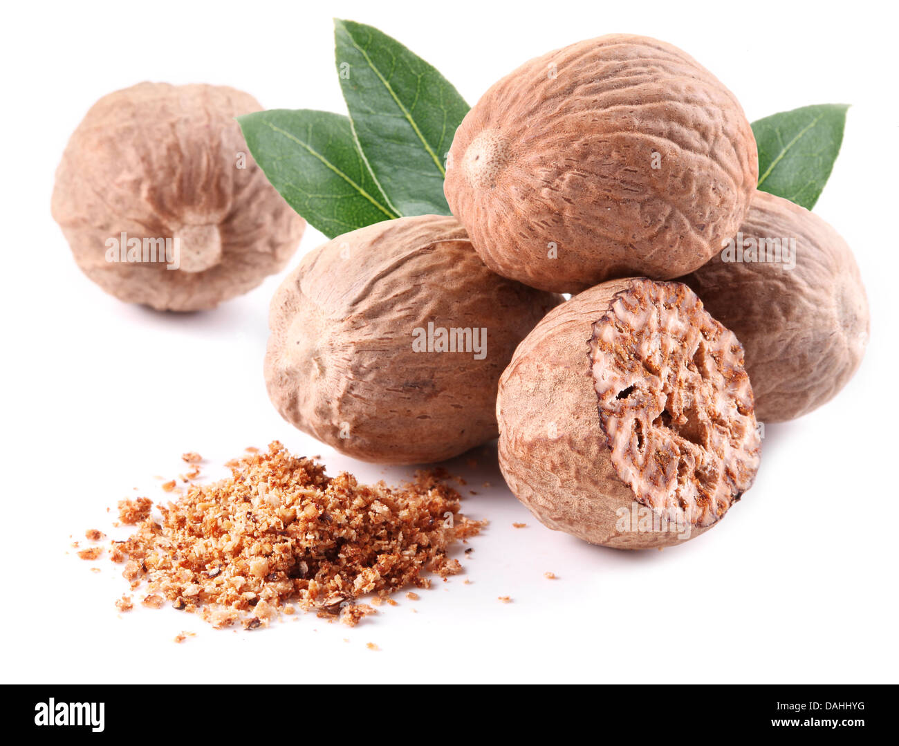 Nutmeg with leaves on a white background Stock Photo - Alamy