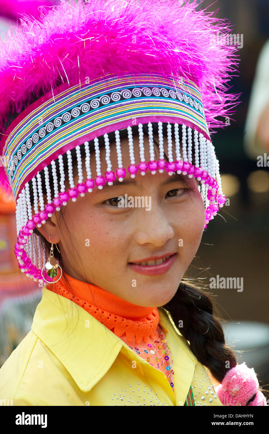Potrait of a young Flower Hmong woman in distinctive headdress, Coc Ly ...