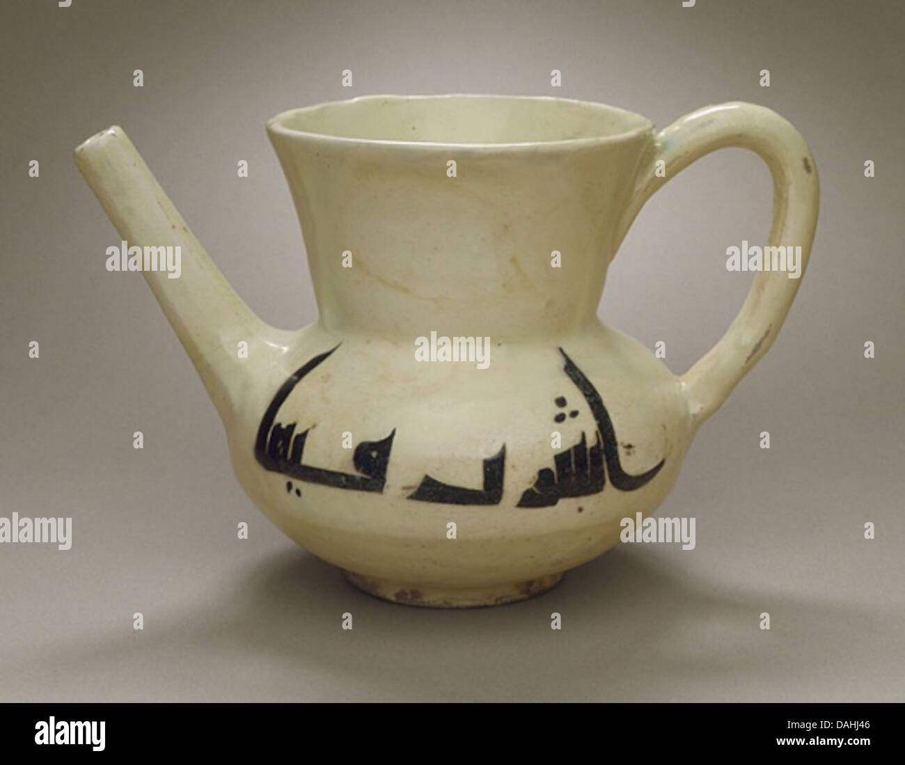 This ewer, crafted from ceramic, features detailed glazing and an ...