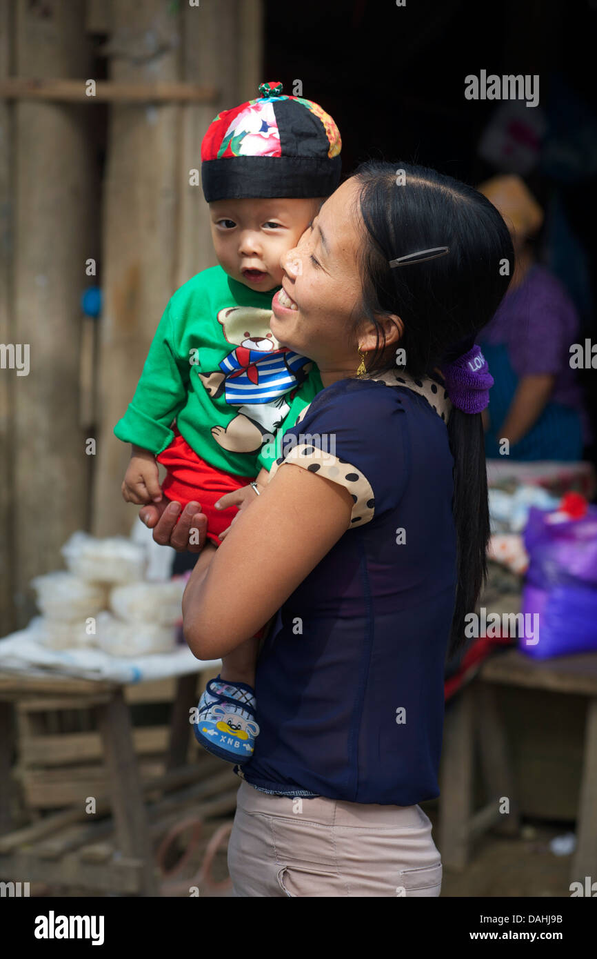 Vietnamese woman carrying young boy. Coc Toc village, Near Ba Be ...
