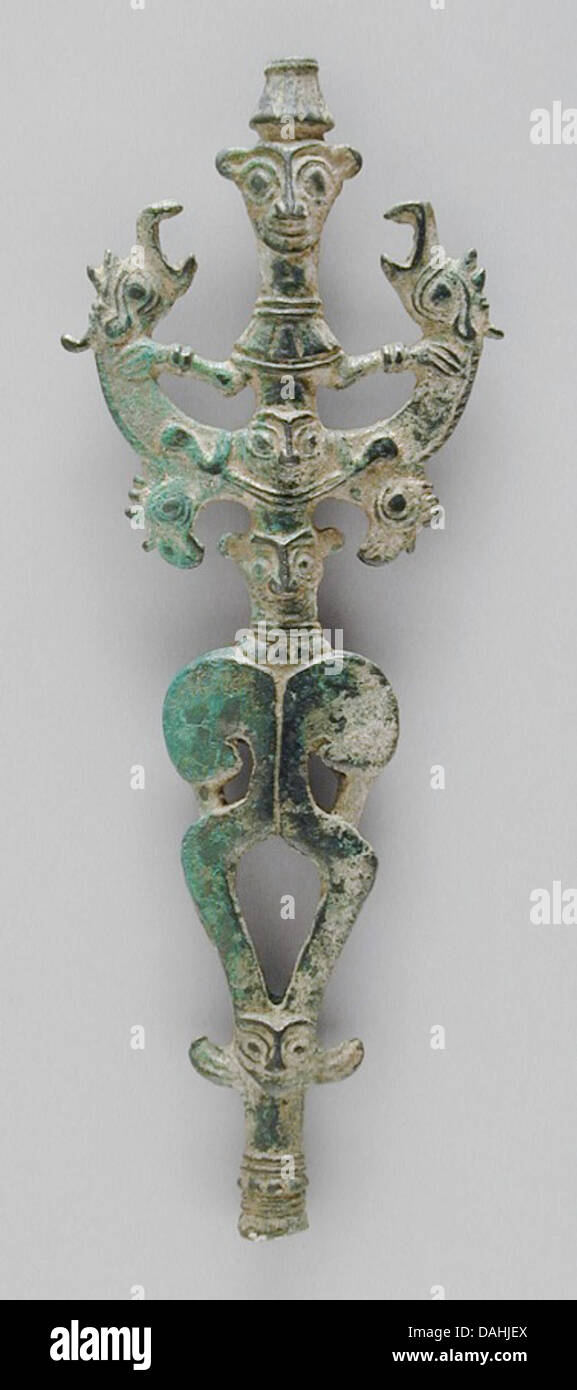 This finial, part of an ornamental design, is crafted in metal and ...