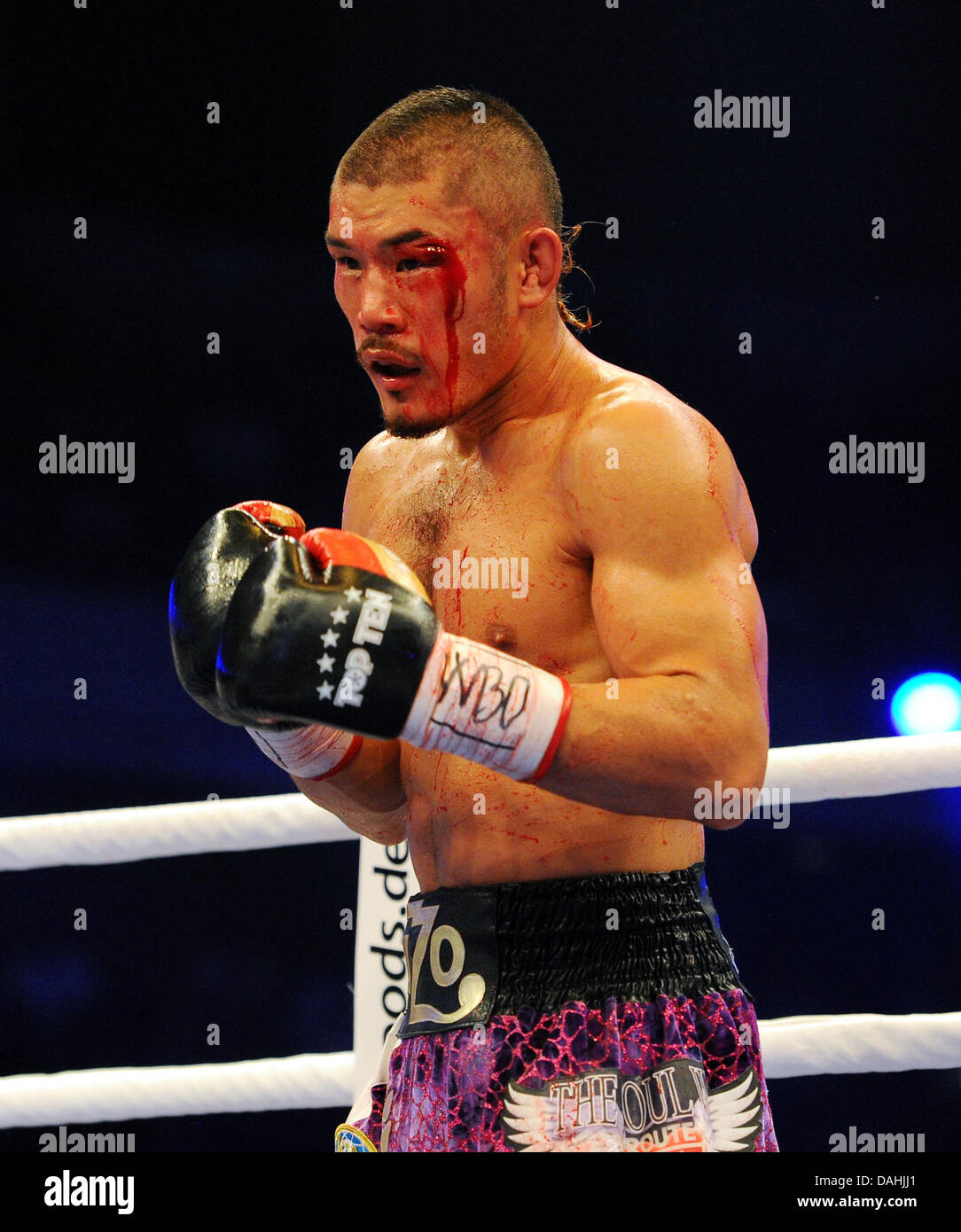 Japan's Yuzo Kiyota keeps on fighting with a bleeding wound, during his ...