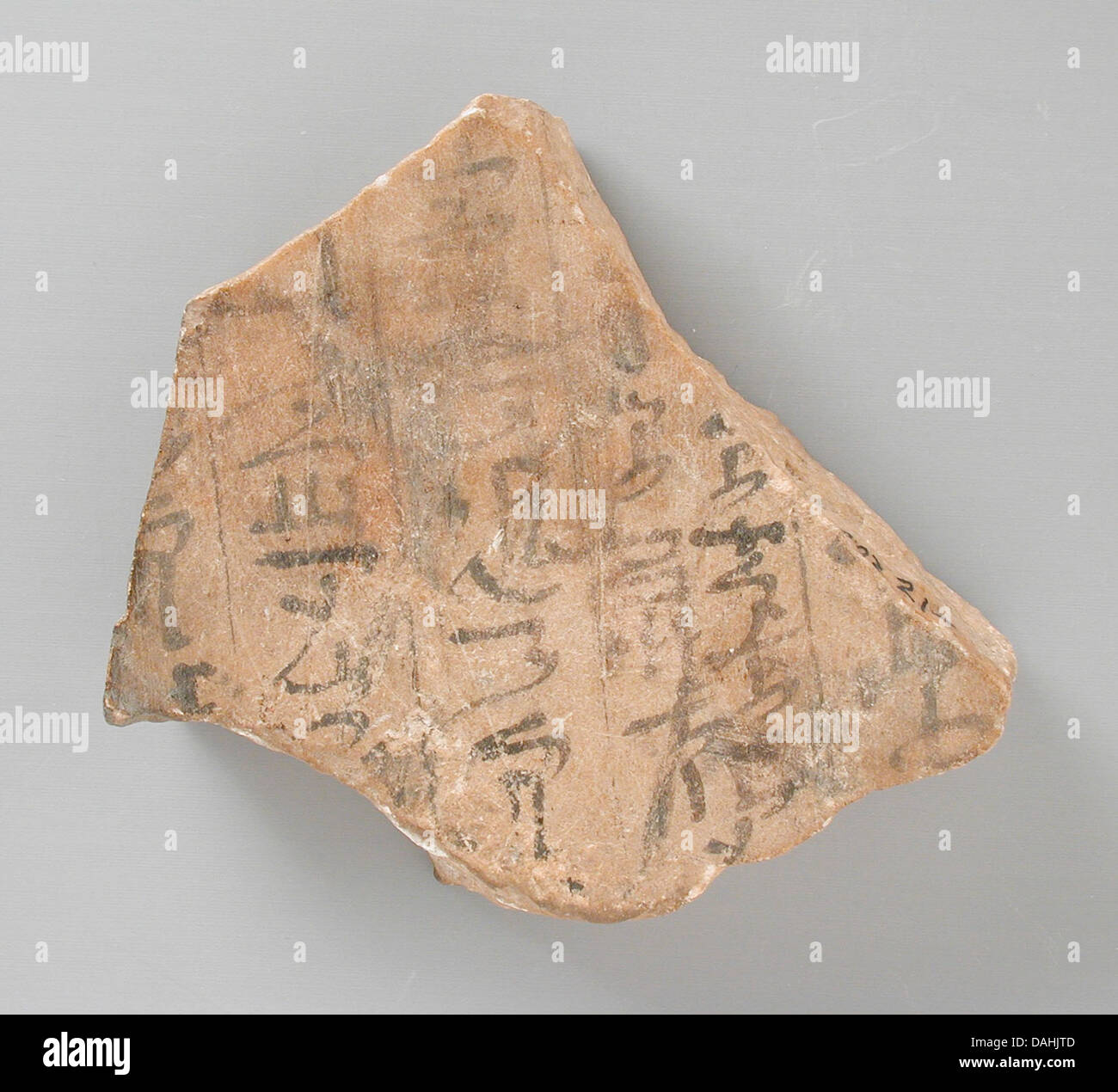 These fragments of a stela are inscribed with ancient script on both ...