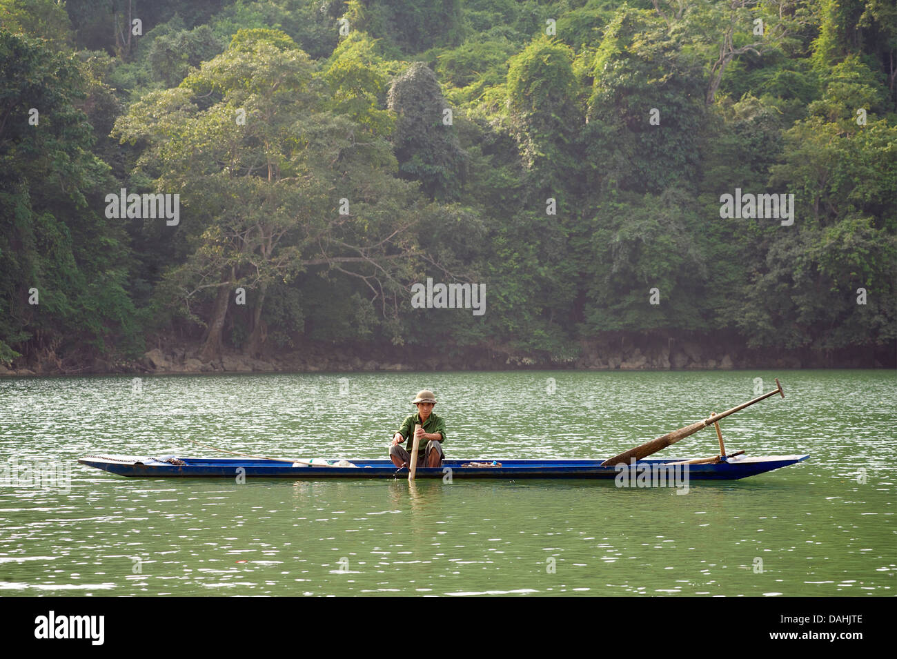 Fisherman smoking a water bong in a boat. Ba Be lake is the largest ...