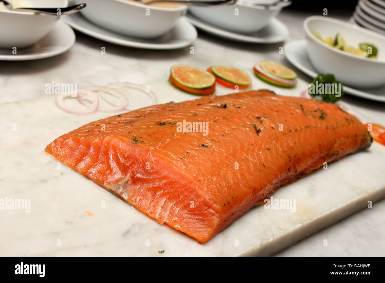 A Marinated salmon Side dishes on cut Board Stock Photo - Alamy