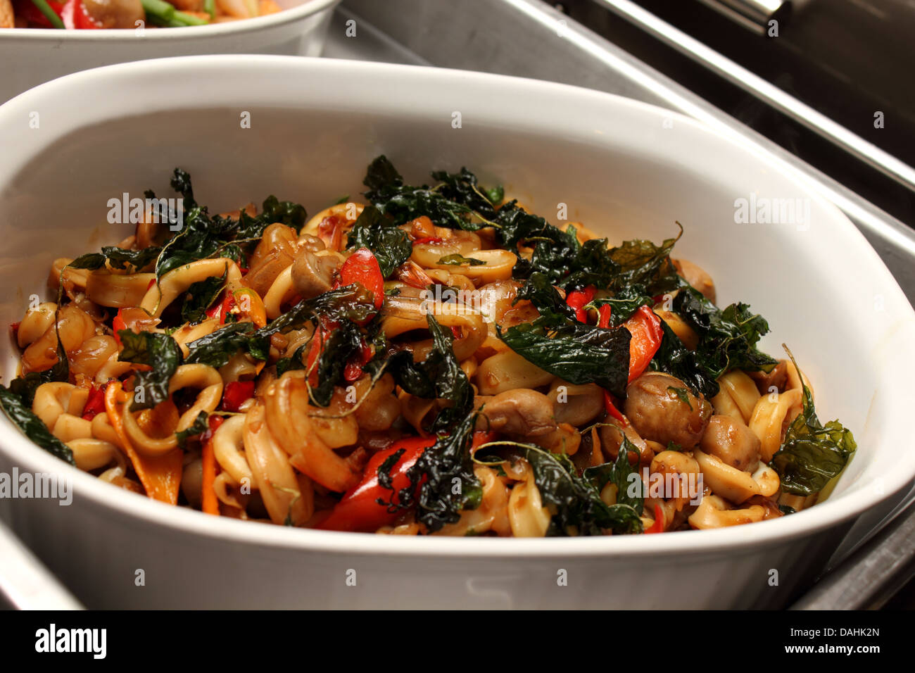 Seafood fried basil in a white bow Stock Photo - Alamy