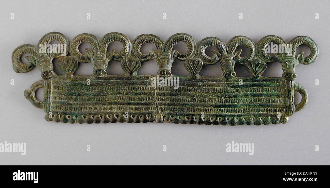 This bronze harness fitting, a cast sculpture, likely belonged to an ...