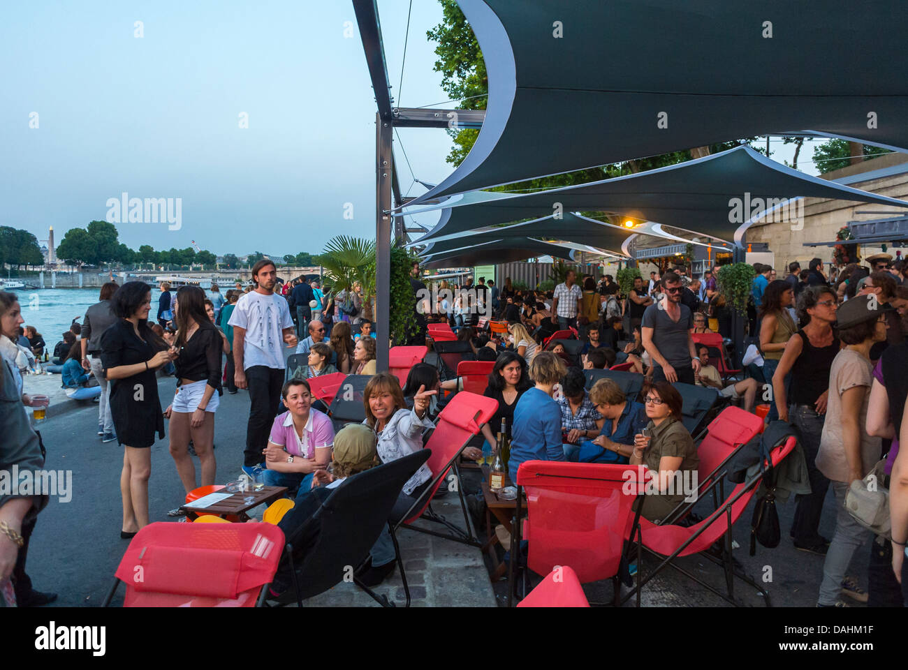 Paris, France, Crowd of Young French People Sharing Drinks on Seine ...