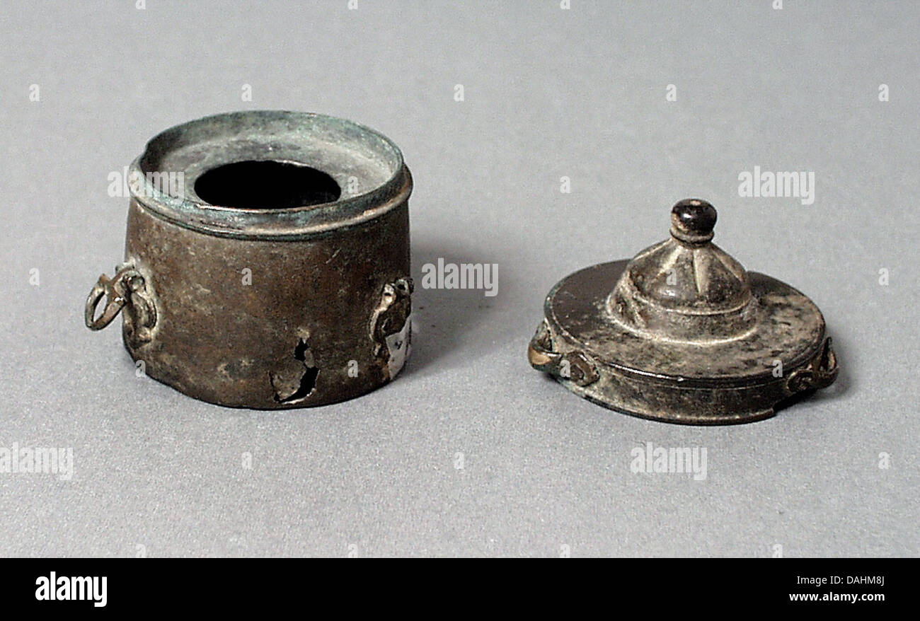 This inkwell with a lid is made from ceramic and features intricate ...