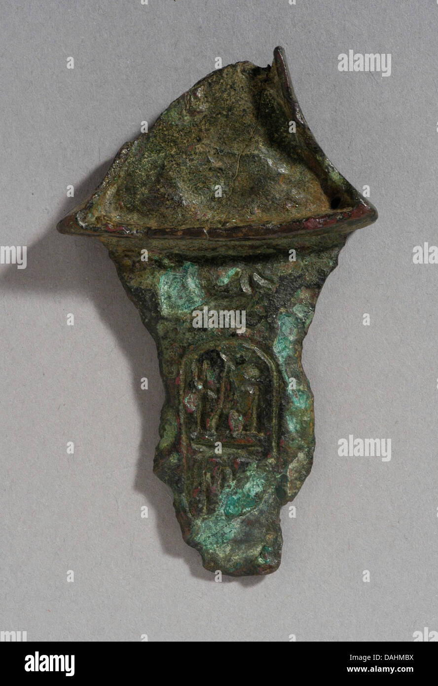 This inscribed dagger hilt and handle, made from bronze, feature ...