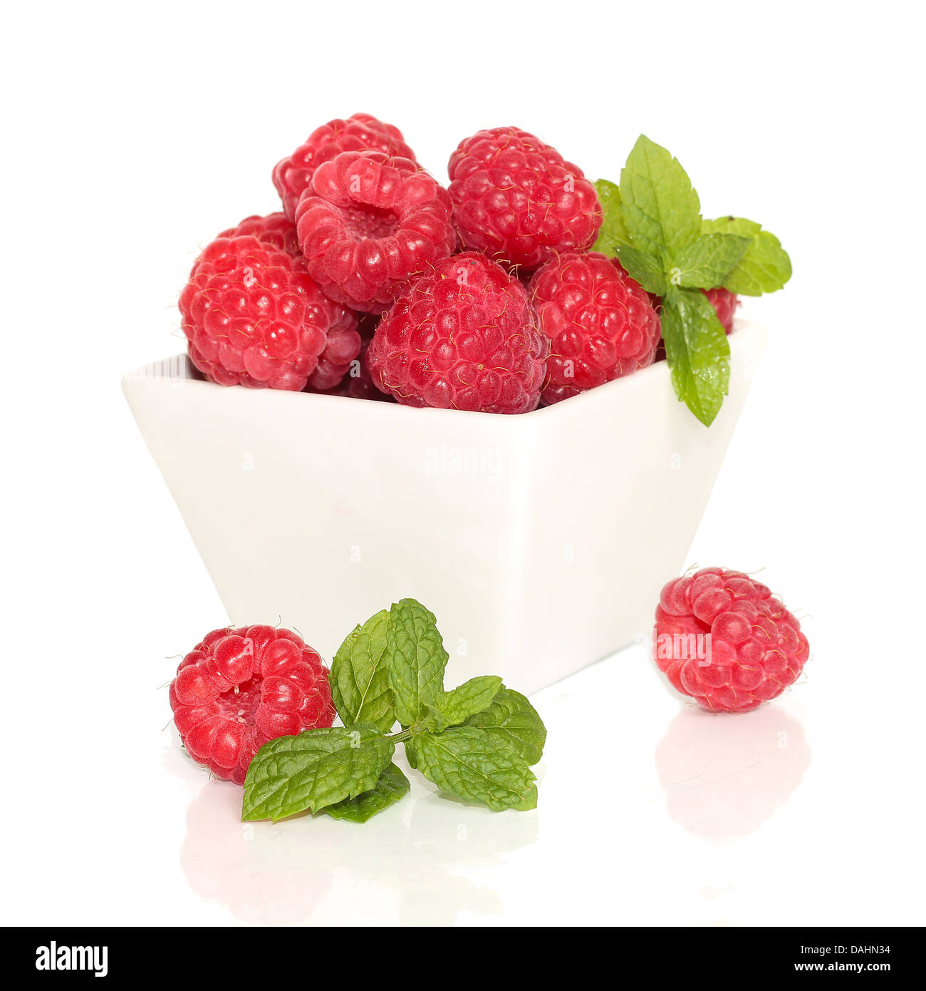 ripe raspberries with mint in bowl Stock Photo - Alamy