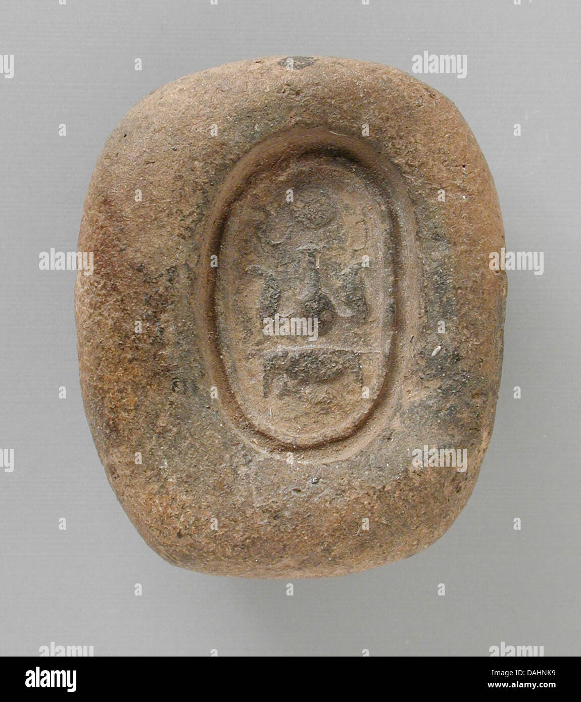 A mold inscribed with an epithet or name, showcasing ancient ...