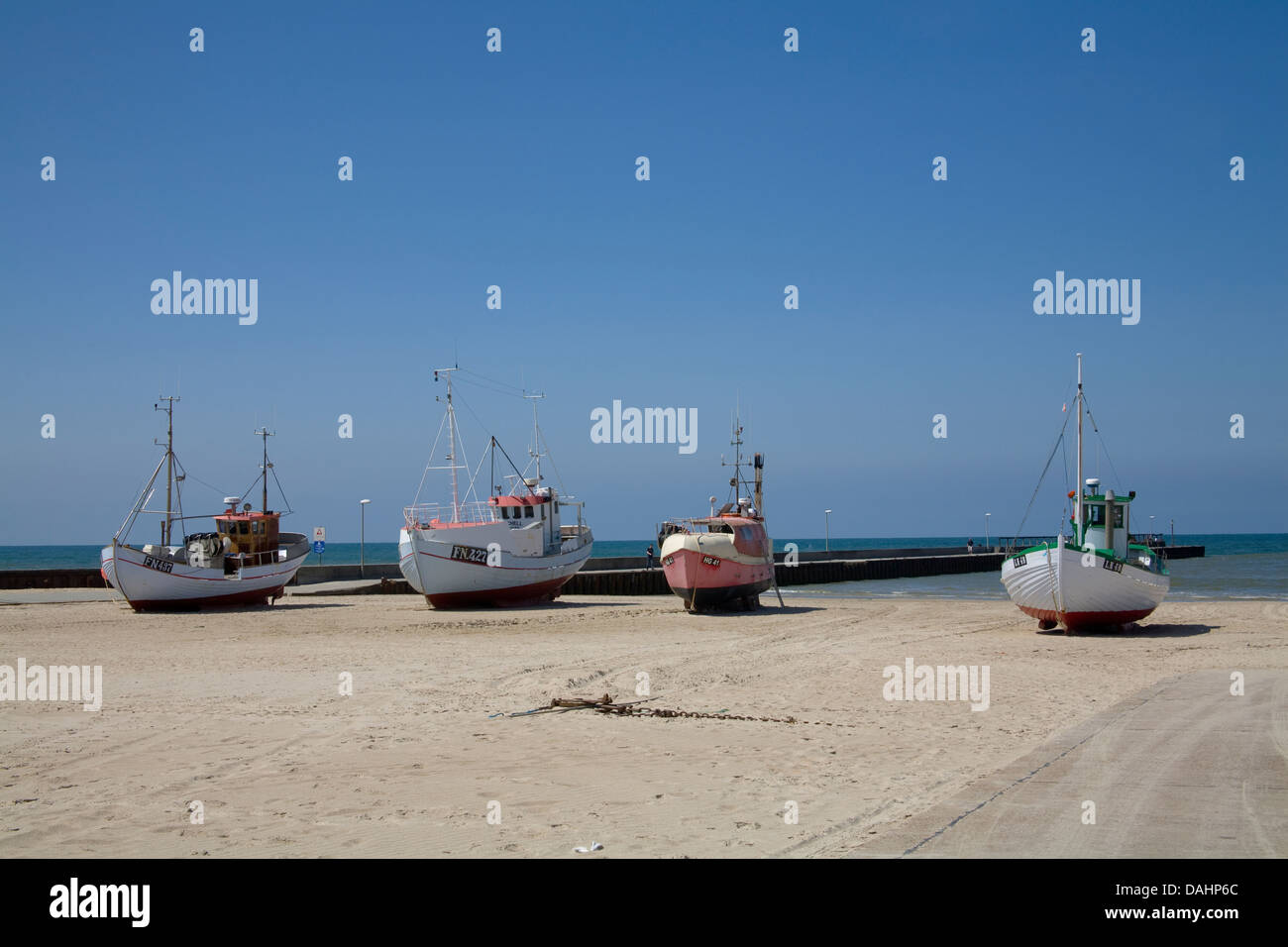 Lokken Denmark EU Fishing boats hauled up on sandy beach of seaside ...