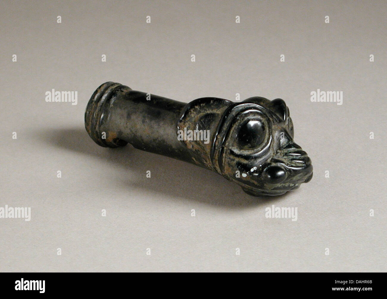 This pinhead, a small yet detailed object, showcases craftsmanship from ...