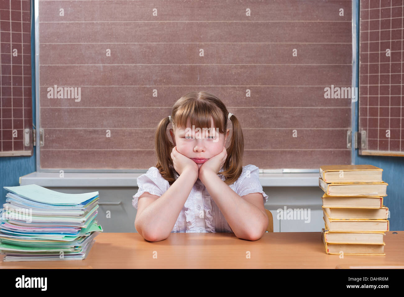 Schoolgirl in a classroom Stock Photo - Alamy