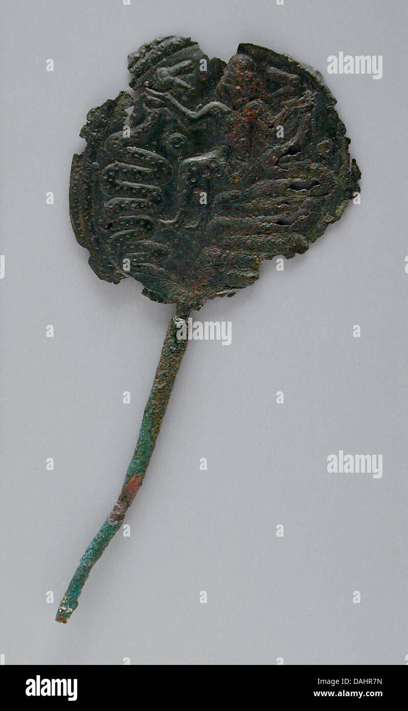 A decorative pin featuring intricate design and craftsmanship ...