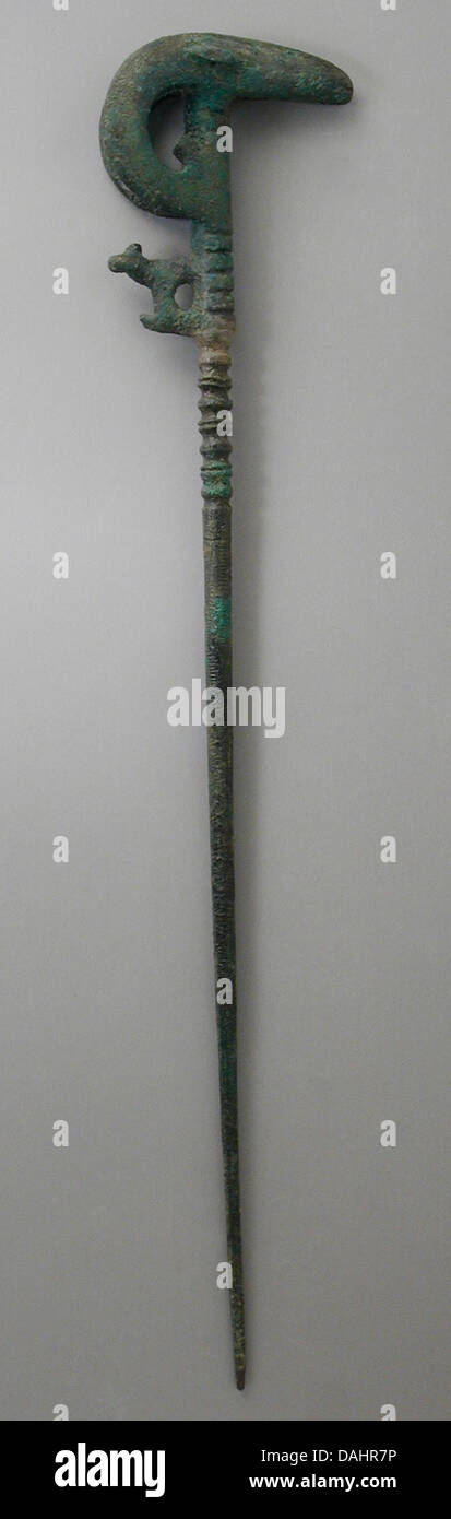 This pin is a delicate example of ornamental jewelry, possibly ...