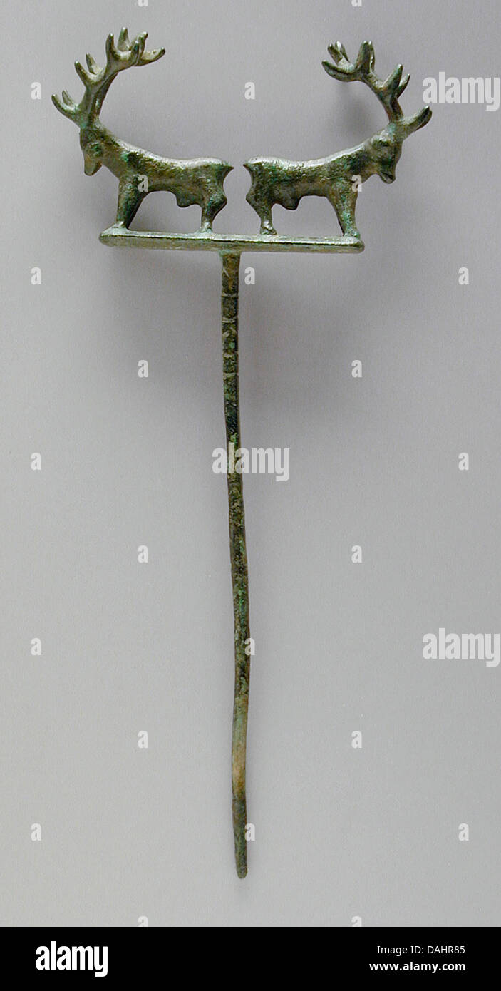 This ornamental pin is a fine example of ancient jewelry, showcasing ...