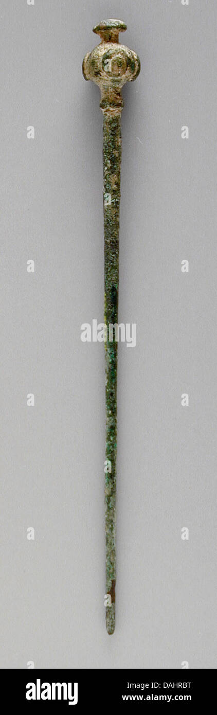 This pin is a detailed example of fine craftsmanship, likely made for ...