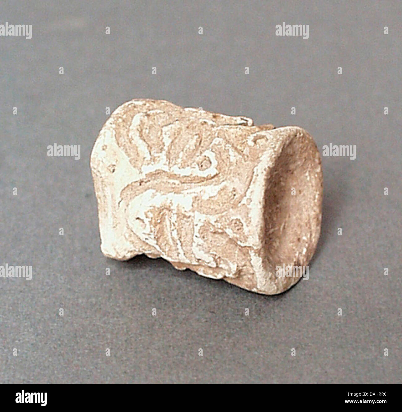 This rolling mold form is an ancient tool used in pottery or ...