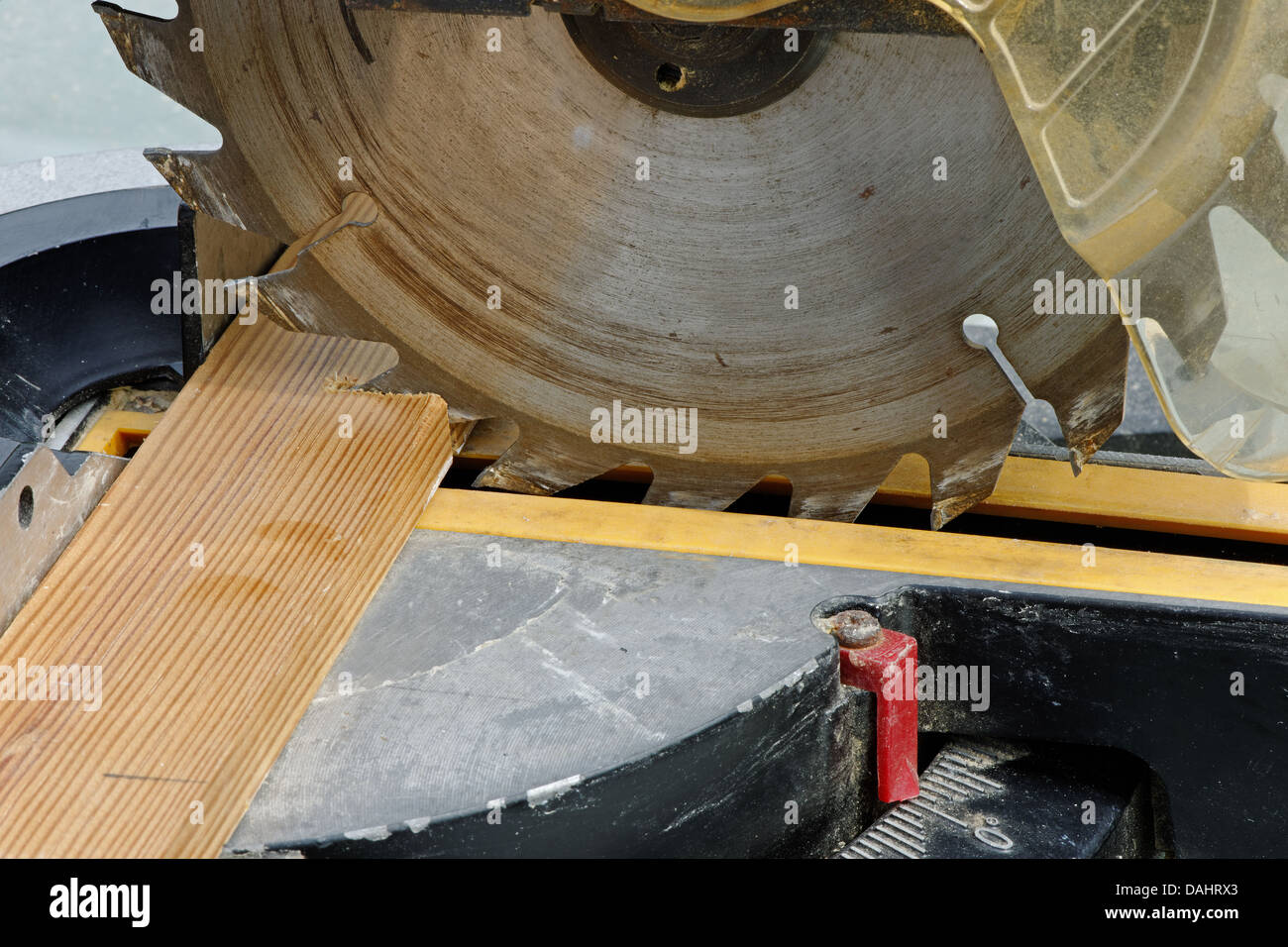 Industrial circular saw cutting a plank of wood in close up Stock Photo ...