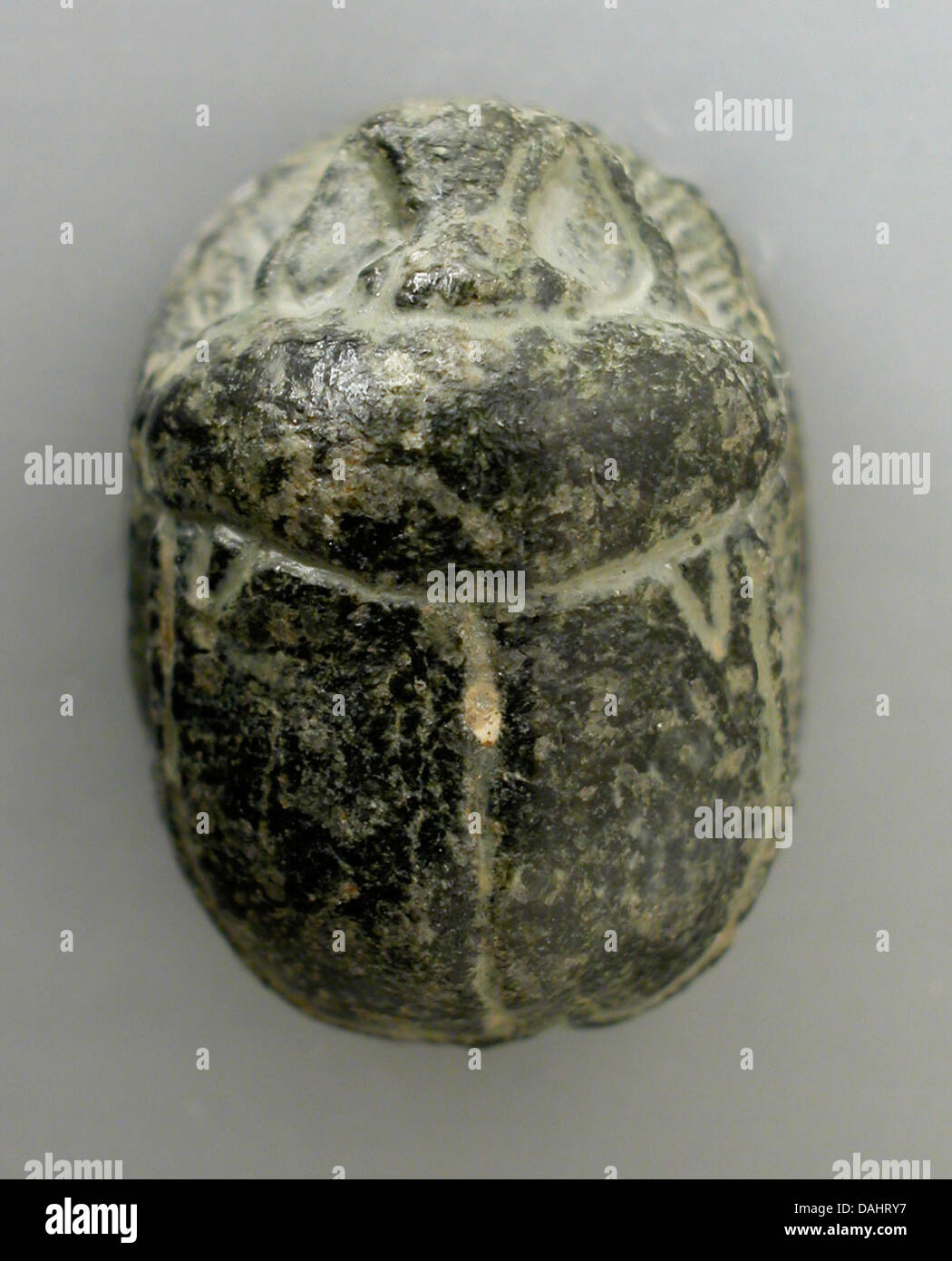 This scarab features cryptographic writing representing the god Amen-Re ...