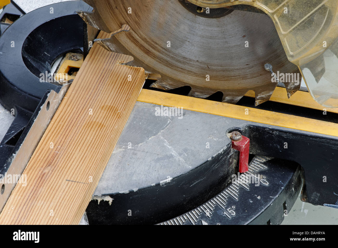Industrial circular saw cutting a plank of wood in close up Stock Photo ...